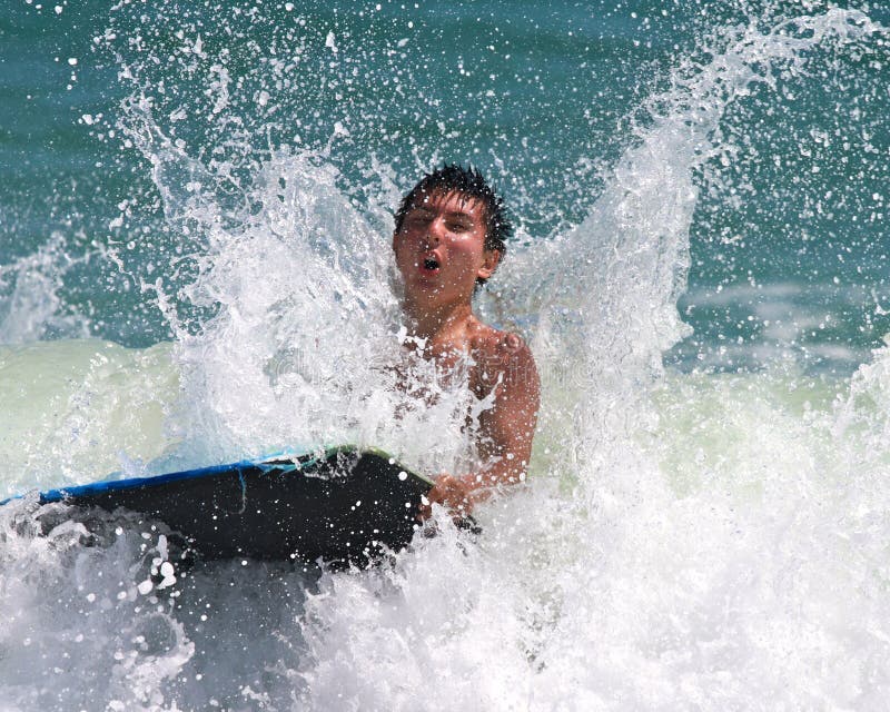 Fun with a Surf Board at the Beach Stock Image - Image of asian, teen ...