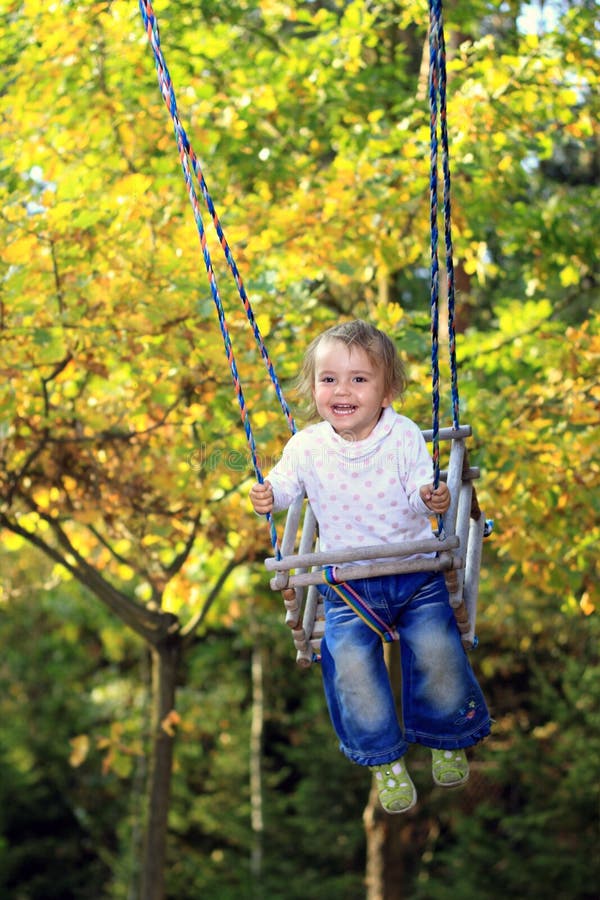 Fun on a swing stock image. Image of background, holidays - 21416151