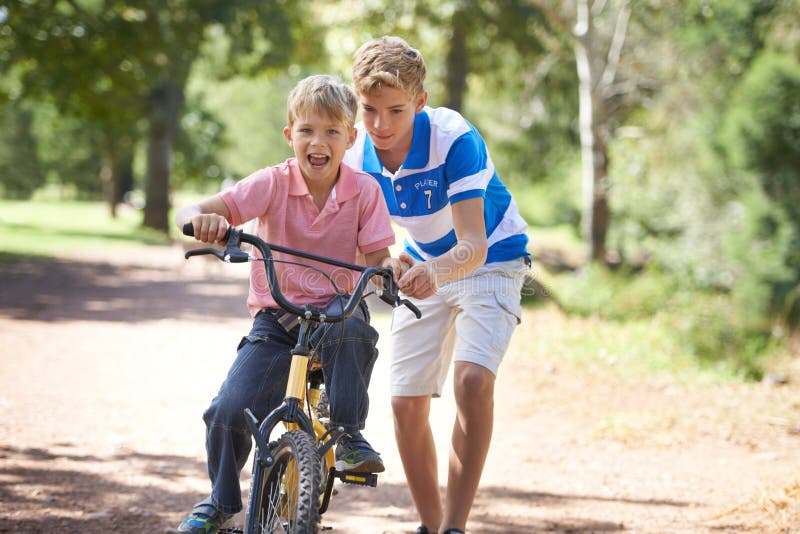 Fun Time with Bikes. Young Boys Riding Bikes Outside. Stock Image ...