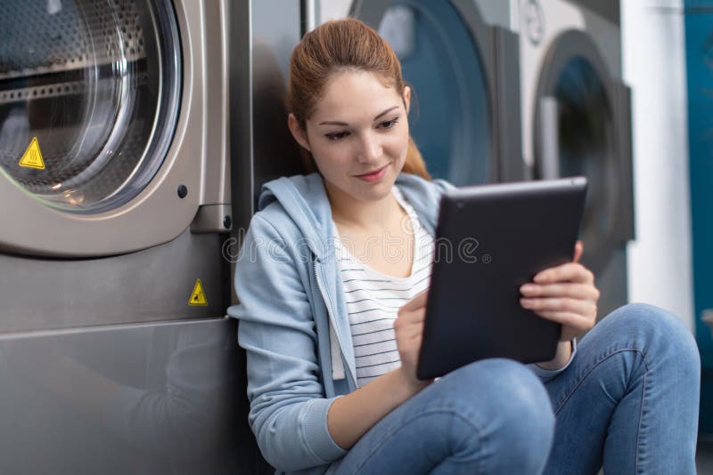 Fun time at laundromat stock photo. Image of equipment - 245447466