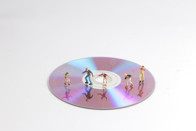 Fun of Tiny Toy Skaters on CD Stock Photo - Image of small, figurine ...