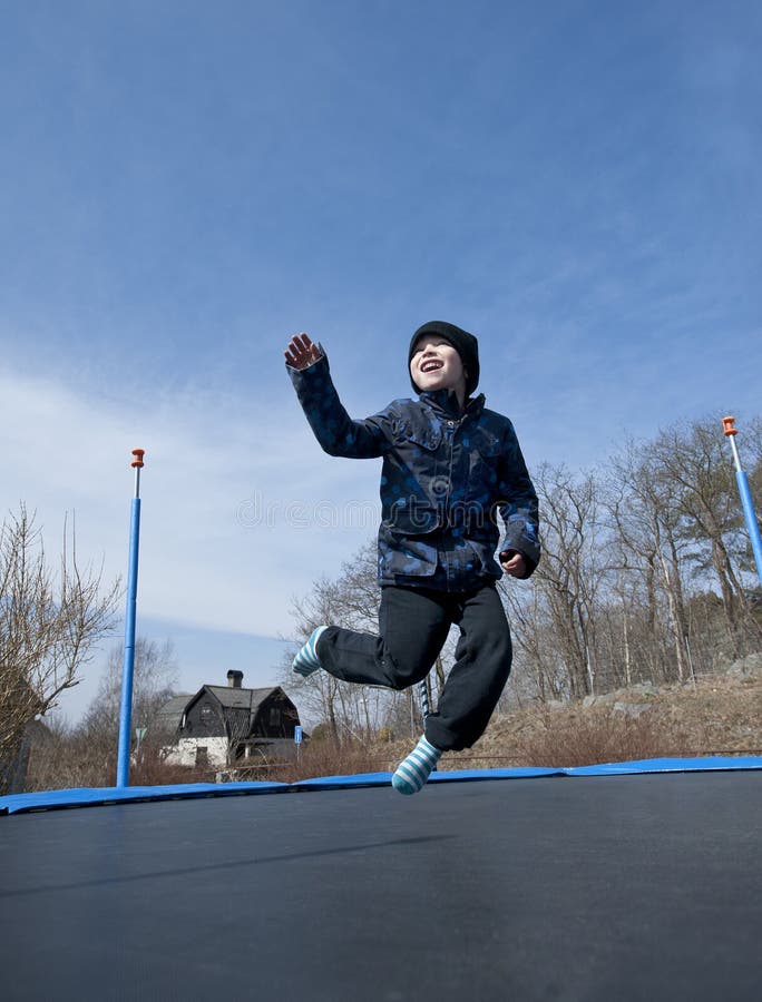 Fun on Trampoline at Springtime Stock Image - Image of backyard ...