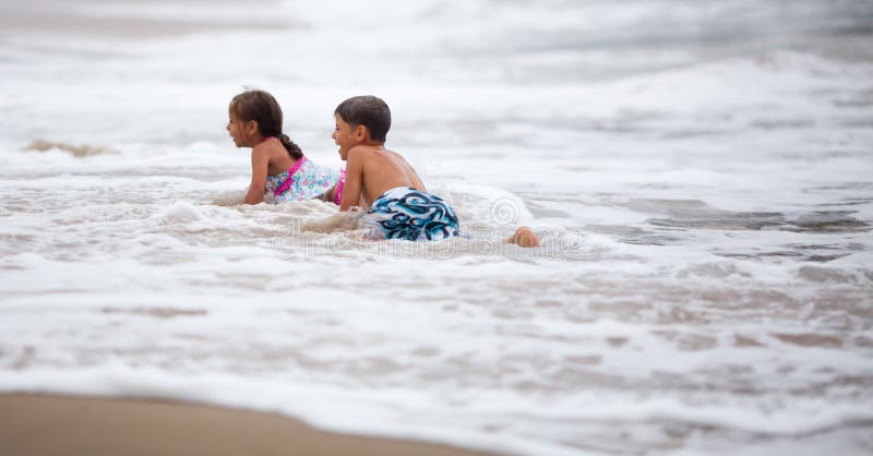 Fun in the waves stock image. Image of childhood, lifestyles - 35550673