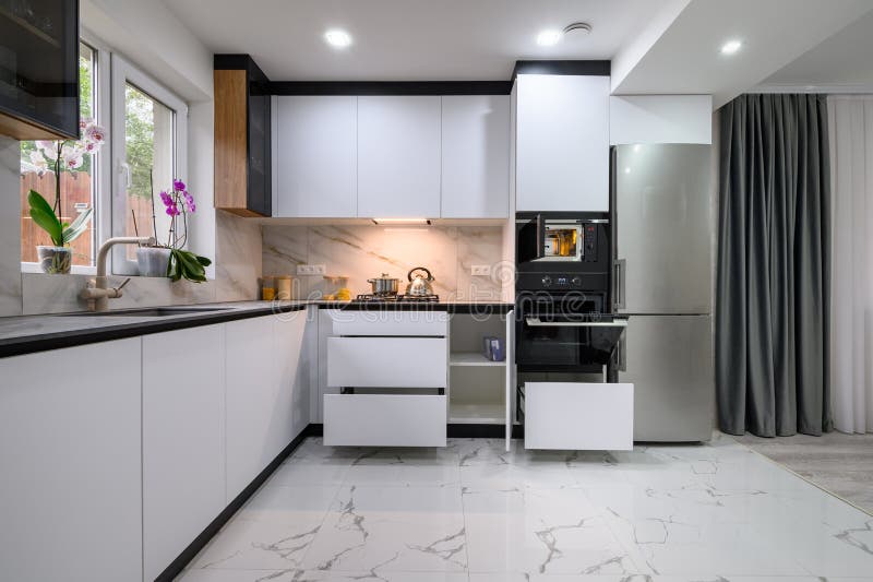 A Functional and Stylish Kitchen with a White Design, a Marble Floor ...
