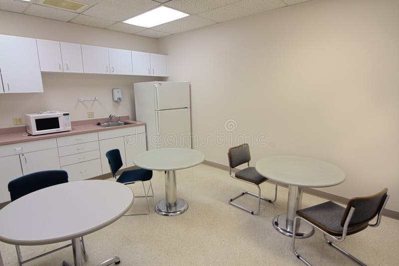 Functional Workplace Break Room with Kitchenette and Seating Area Stock ...