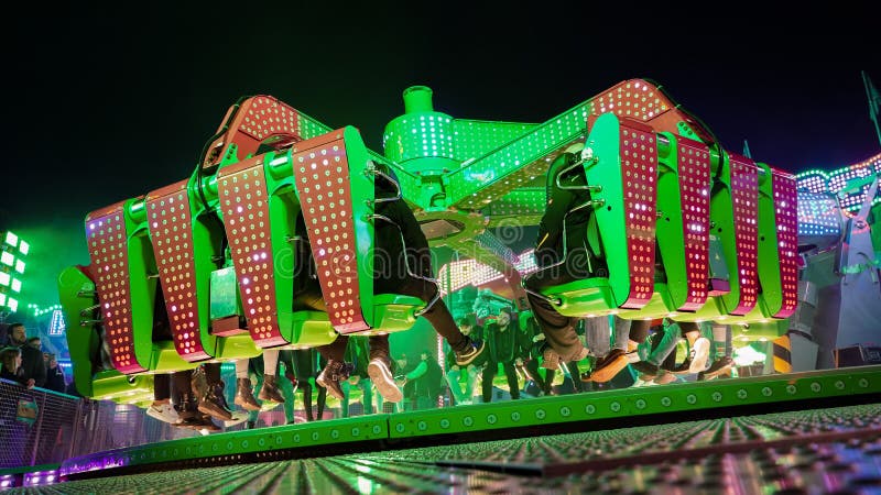 Funfair at night with ride editorial image. Image of neon - 243980095