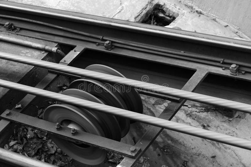 Cable Car and Cable Car Rails or Gondola Lift and Tall Concrete Post in ...