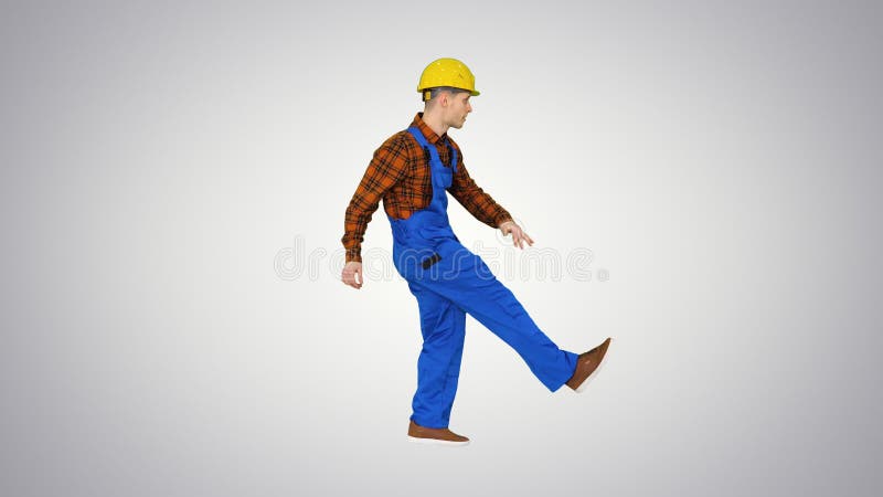 Funky Dancing by Young Construction Worker in Safety Hat on Gradient ...