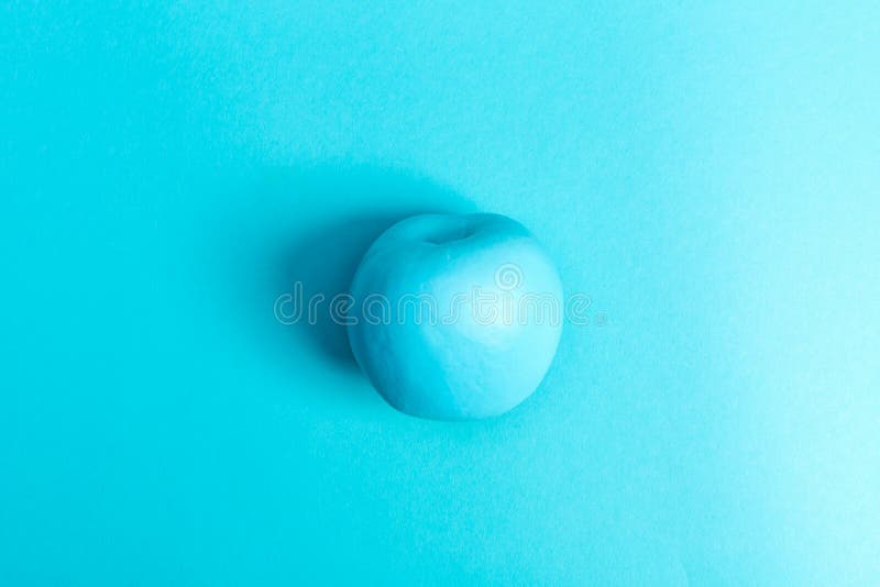 Funky Fruit Painted Apple on a Blue Background Stock Image - Image of ...