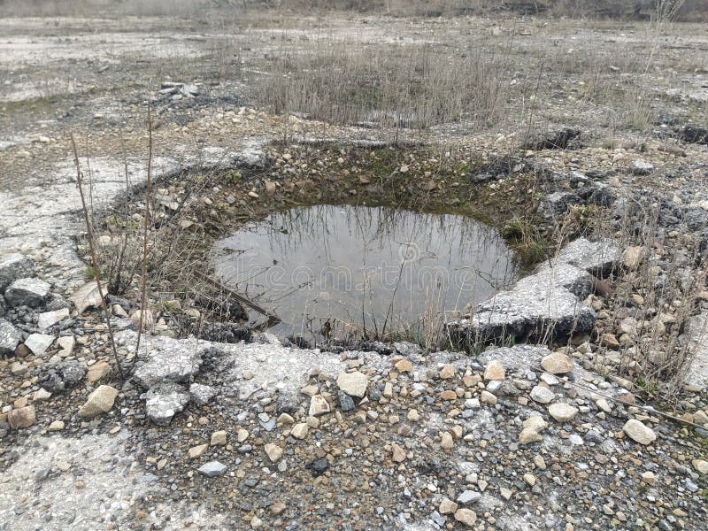 Funnel from a Projectile Hit Stock Photo - Image of projectile, ukraine ...