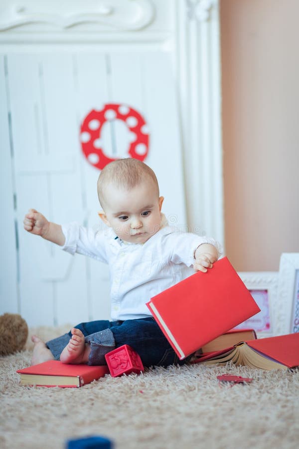 Funny baby with books stock photo. Image of education - 54946898