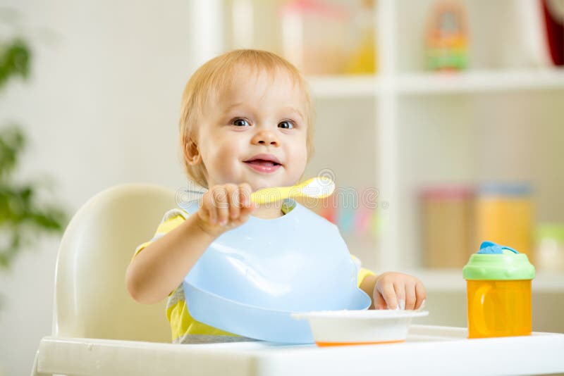 Funny Baby Child Boy Eating Itself with Spoon in Stock Image - Image of ...