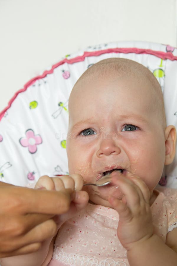 Funny Baby Feeding with a Spoon Stock Photo - Image of meal, funny ...
