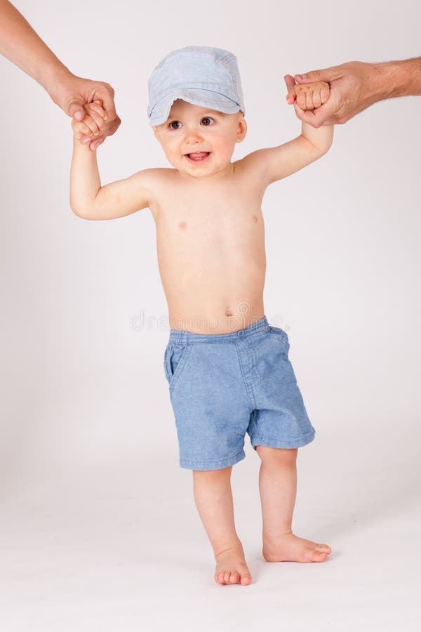 A Funny Baby is Trying To Walk Stock Image - Image of holding, life ...