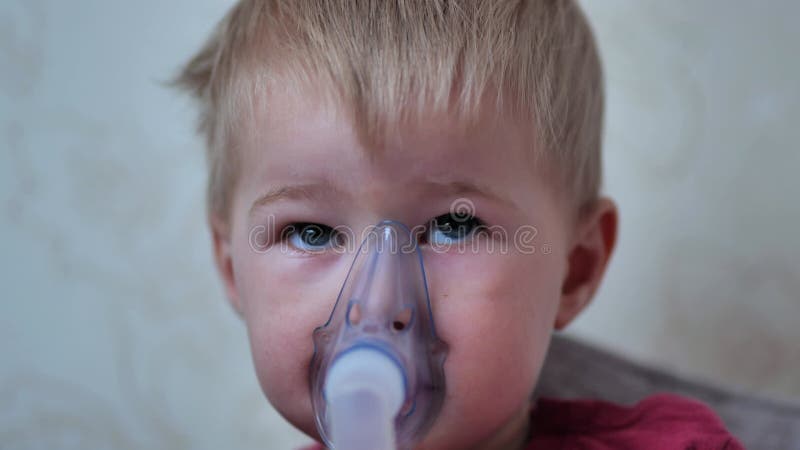 Funny Boy Breathing through an Inhaler Mask. Stock Footage - Video of ...