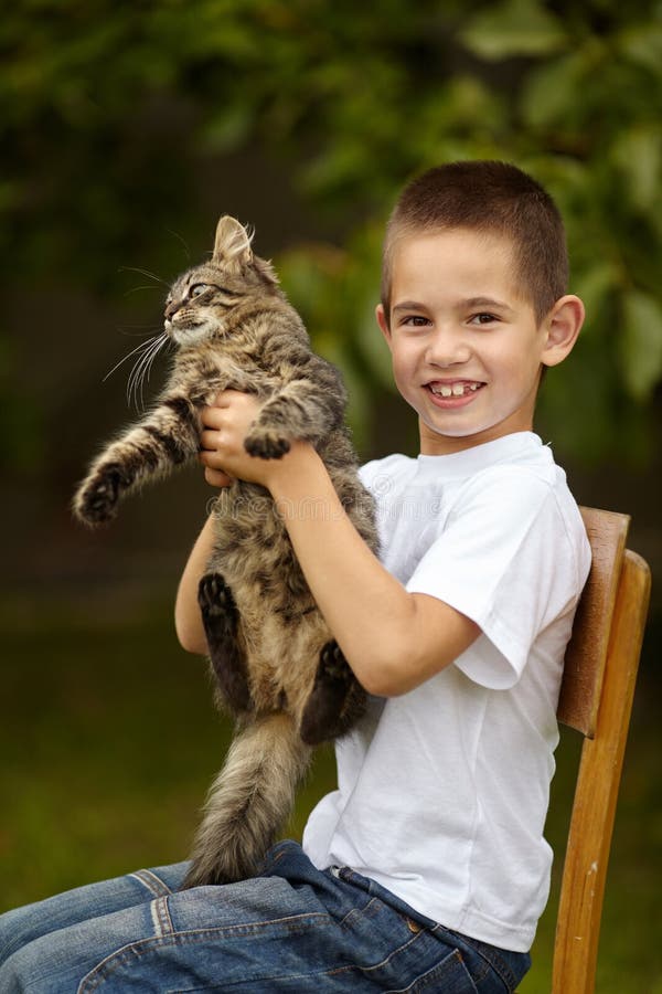 Funny boy with cat stock photo. Image of grey, gently - 75132428