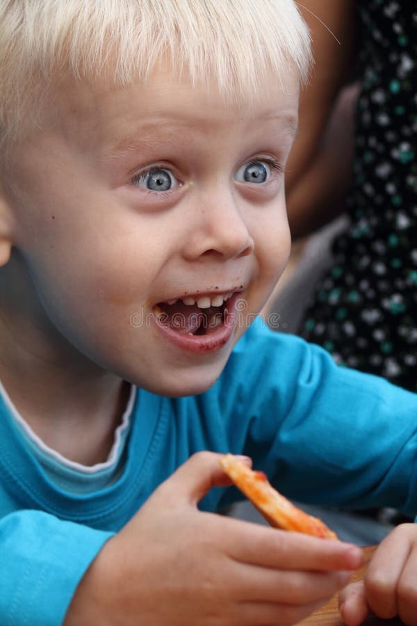 Funny boy grimaces stock photo. Image of calm, closeup - 69130210