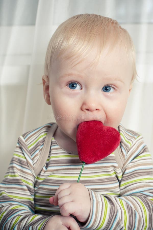 Funny boy with heart stock image. Image of child, heart - 12571353