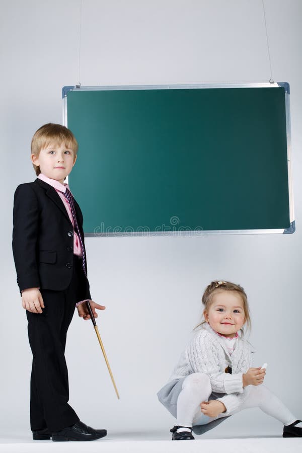 Funny Boy Teaching Younger Sister Stock Photo - Image of sitting, male ...