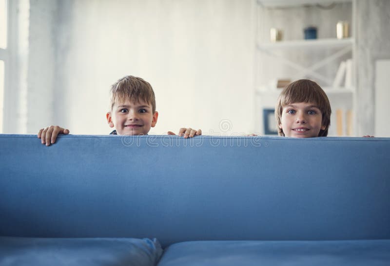 Boy Hiding Behind Sofa Stock Photos - Free & Royalty-Free Stock Photos ...
