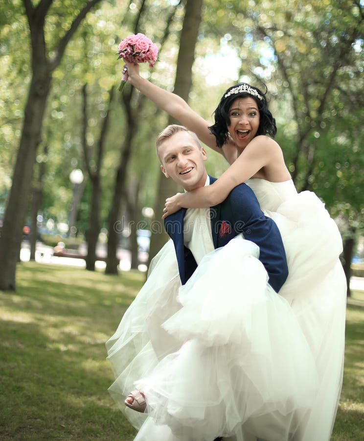 Funny Bride and Groom Having Fun in the Park Stock Image - Image of ...