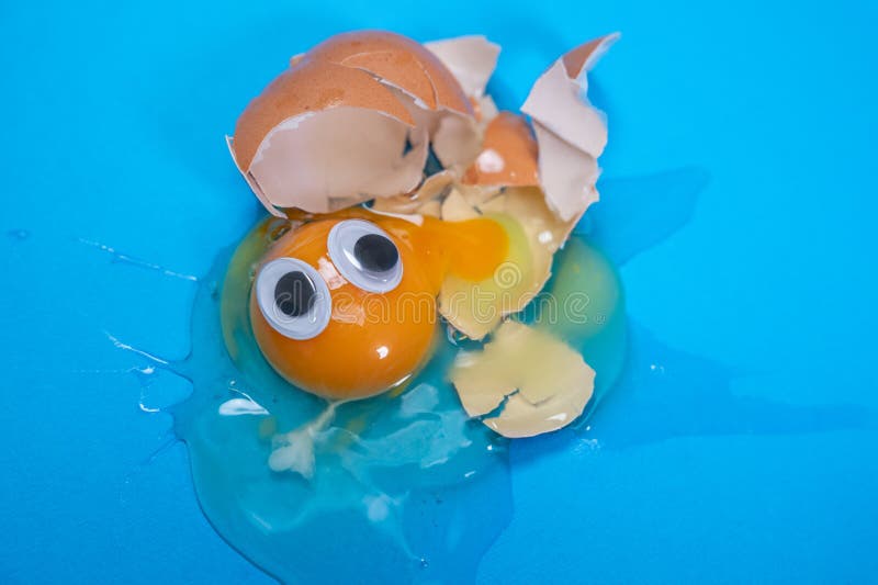 Funny Broken Egg with Googly Eyes on Blue Background Stock Image ...