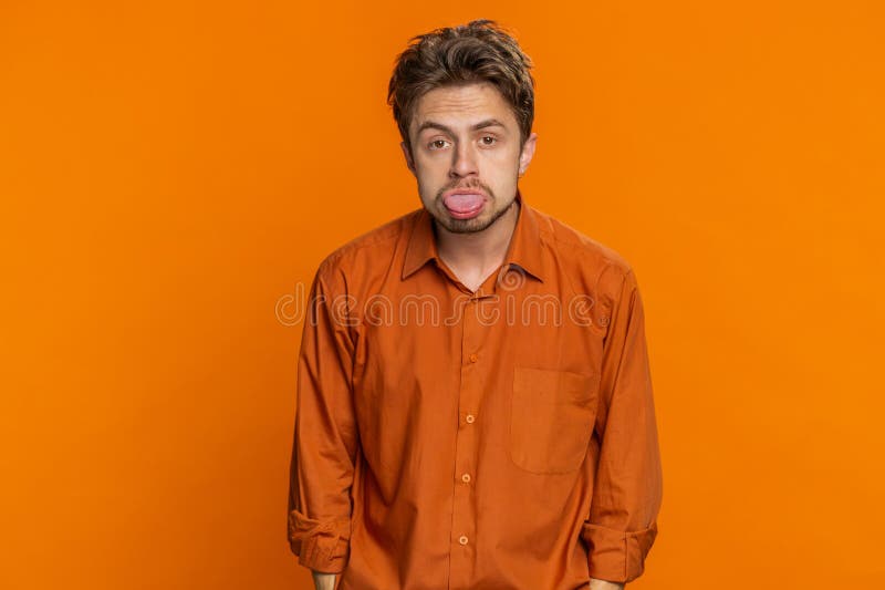 Funny Bully Caucasian Young Man Showing Tongue Making Silly Faces
