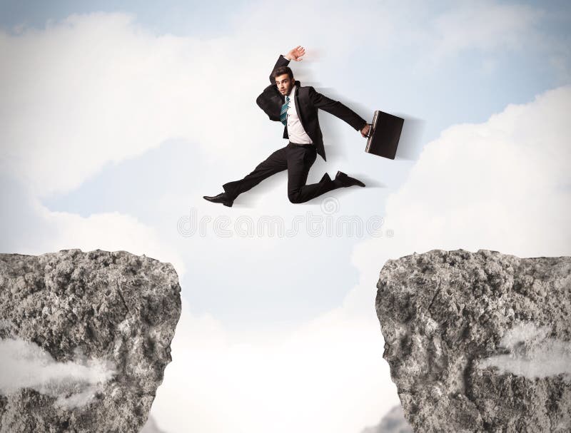 Funny Business Man Jumping Over Rocks with Gap Stock Photo - Image of ...
