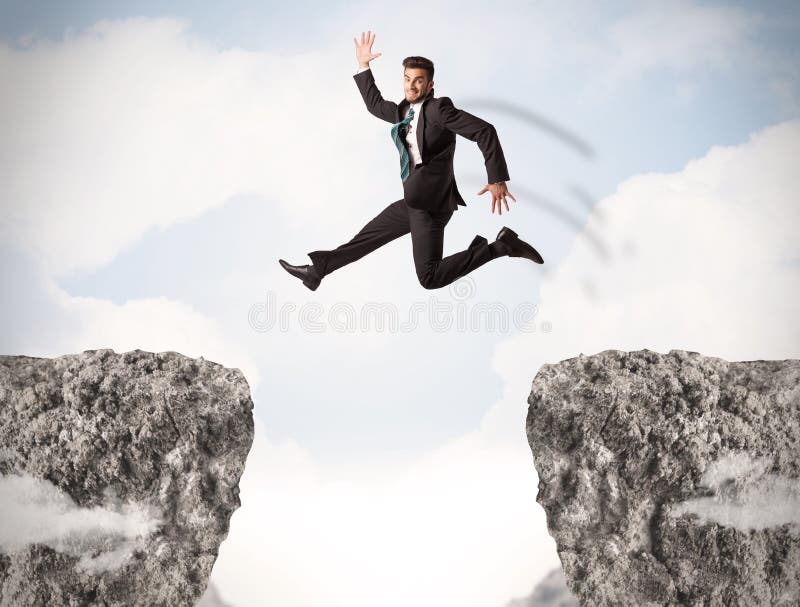 Funny Business Man Jumping Over Rocks with Gap Stock Photo - Image of ...