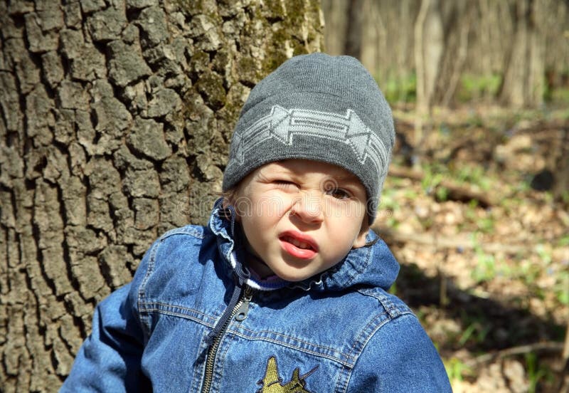 Funny Child Closing One Eye from the Sun Stock Image - Image of color ...
