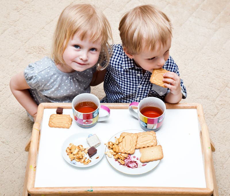 Funny Children are Eating Dessert Stock Image - Image of cookies, cakes ...