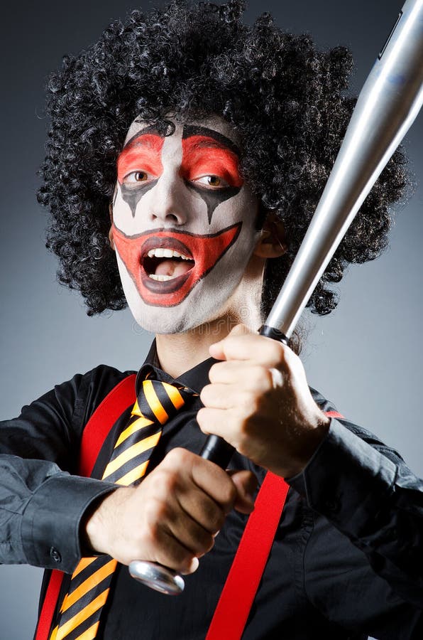 Funny clown with bat stock image. Image of adult, male - 25871041