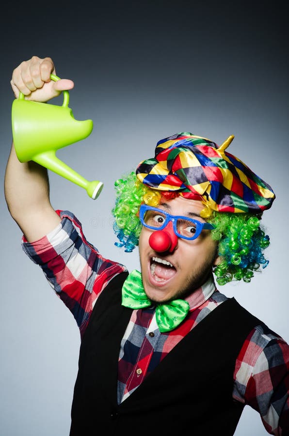 Funny clown with watering stock photo. Image of comedy - 41913382