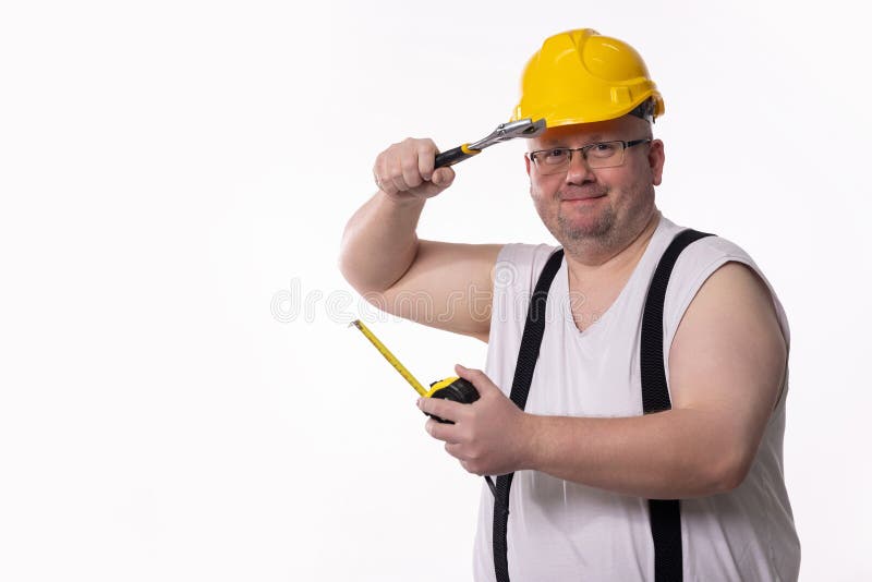 A Funny Construction Worker Using Various Tools and Wearing a Yellow ...