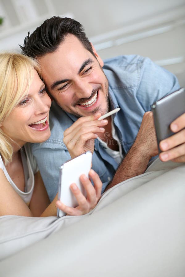 Funny Couple Comparing Smartphones Home Stock Photos - Free & Royalty ...