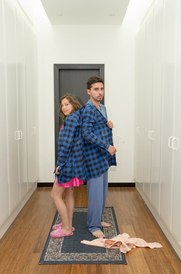 Funny Couple Getting Dressed in Pijamas Stock Image - Image of business ...