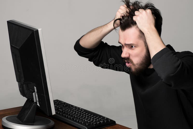 Exhausted Trader with Head in Hands Leaning at Computer Desk Stock ...