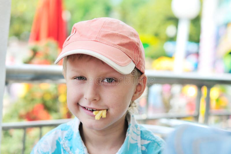 Funny cute boy in cafe stock image. Image of junk, bite - 15175497