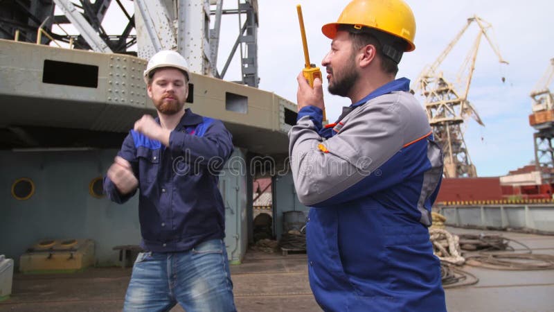 Dock Worker and Engineer Have Serious Talk, Then Laugh and Give High ...