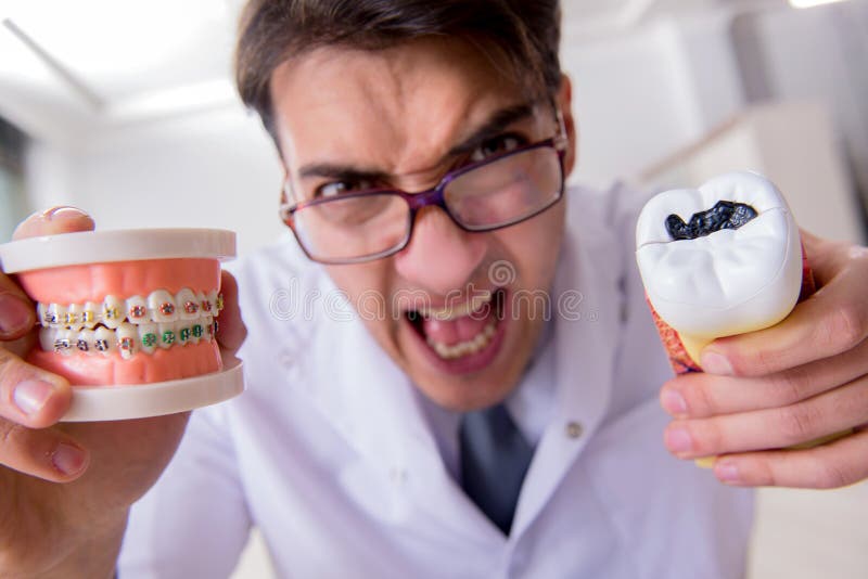 The Funny Dentist with Teeth Model in Hospital Stock Photo - Image of ...