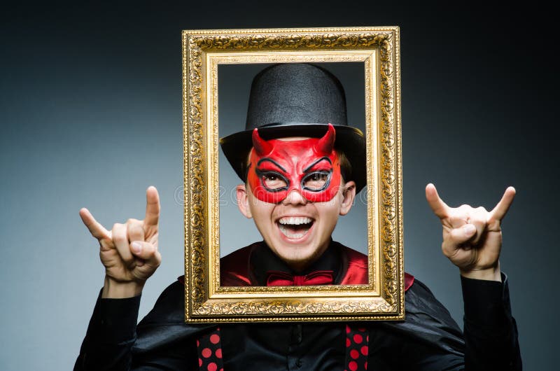 Funny devil with picture stock image. Image of passepartout - 42205309