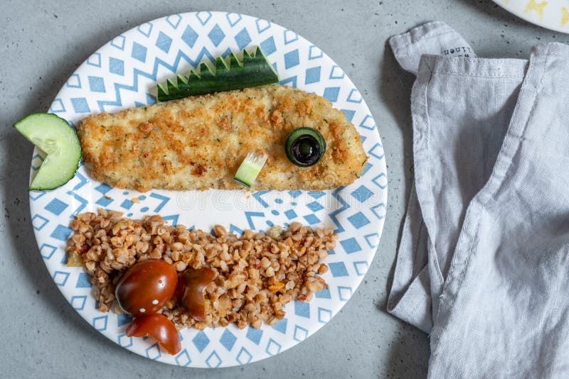 Funny Dinner with Fish and Buckwheat for Kids Stock Image - Image of ...