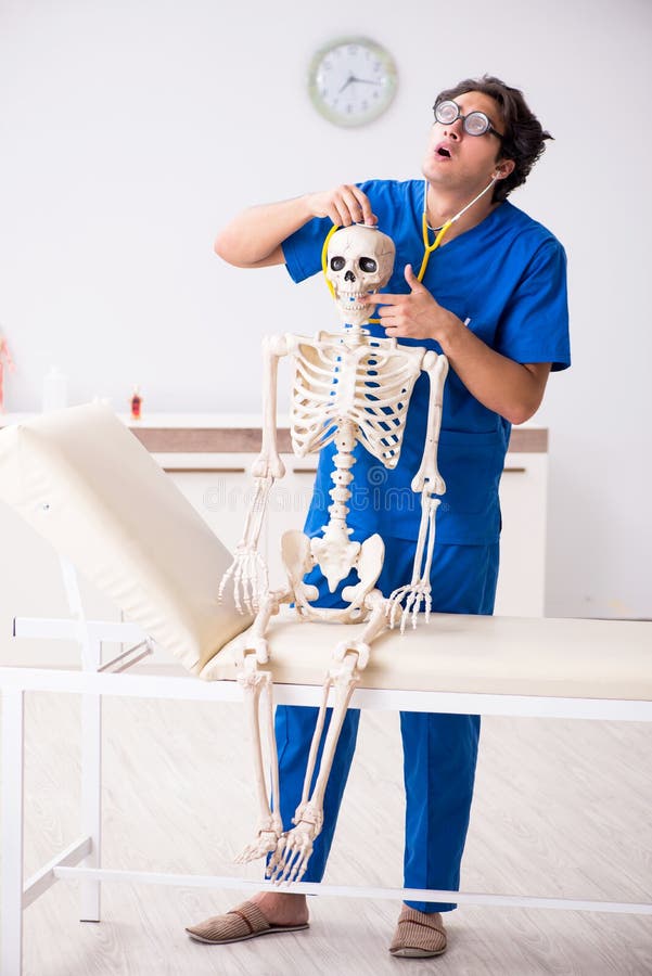 The Funny Doctor with Skeleton in Hospital Stock Photo - Image of beat ...