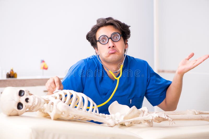 The Funny Doctor with Skeleton in Hospital Stock Photo - Image of ...