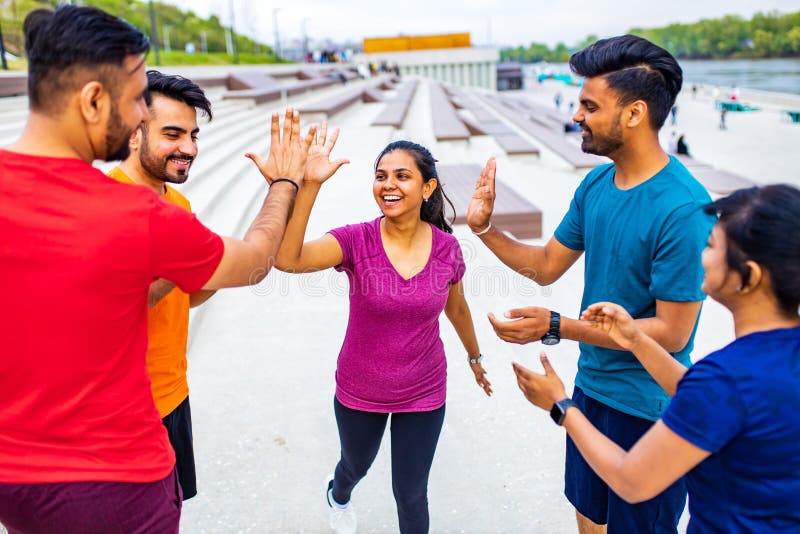 Funny Eastern Ethnic People Exercising Together Outdoor Stock Image ...