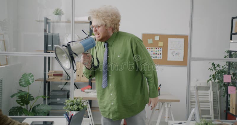 Funny Evil Guy Yelling at Subordinates Using Megaphone in Office Stock ...