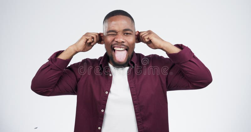 Funny, Face and Black Man with Tongue Out in Studio, Ear Pull and Crazy ...