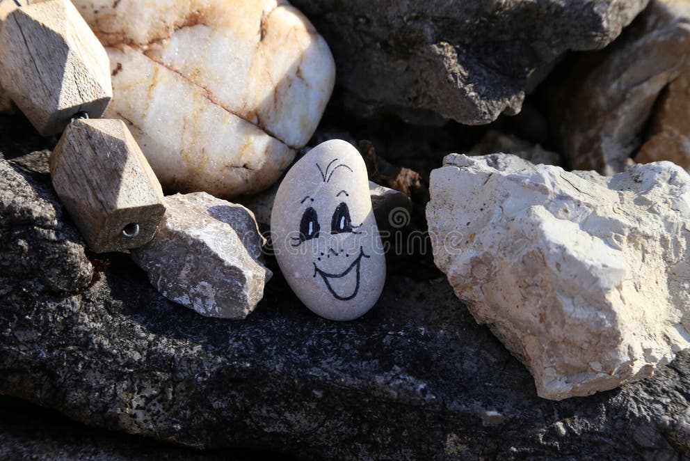 Funny Face is Drawn on a Round Pebble Stock Image - Image of children ...