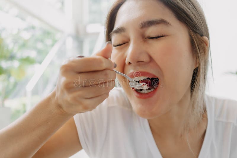 Funny Face Of Happy Woman Eating Cake Carelessly In The Cafe Stock