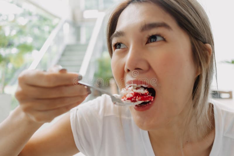 Funny Face Of Happy Woman Eating Cake Carelessly In The Cafe Stock